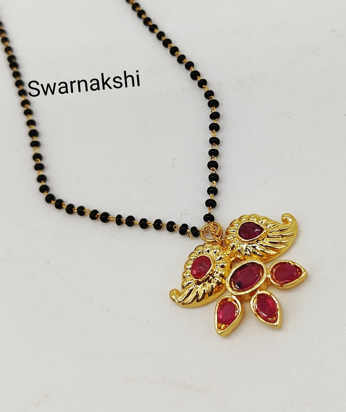 1 gram gold black beads chains online with mango design pendant ...