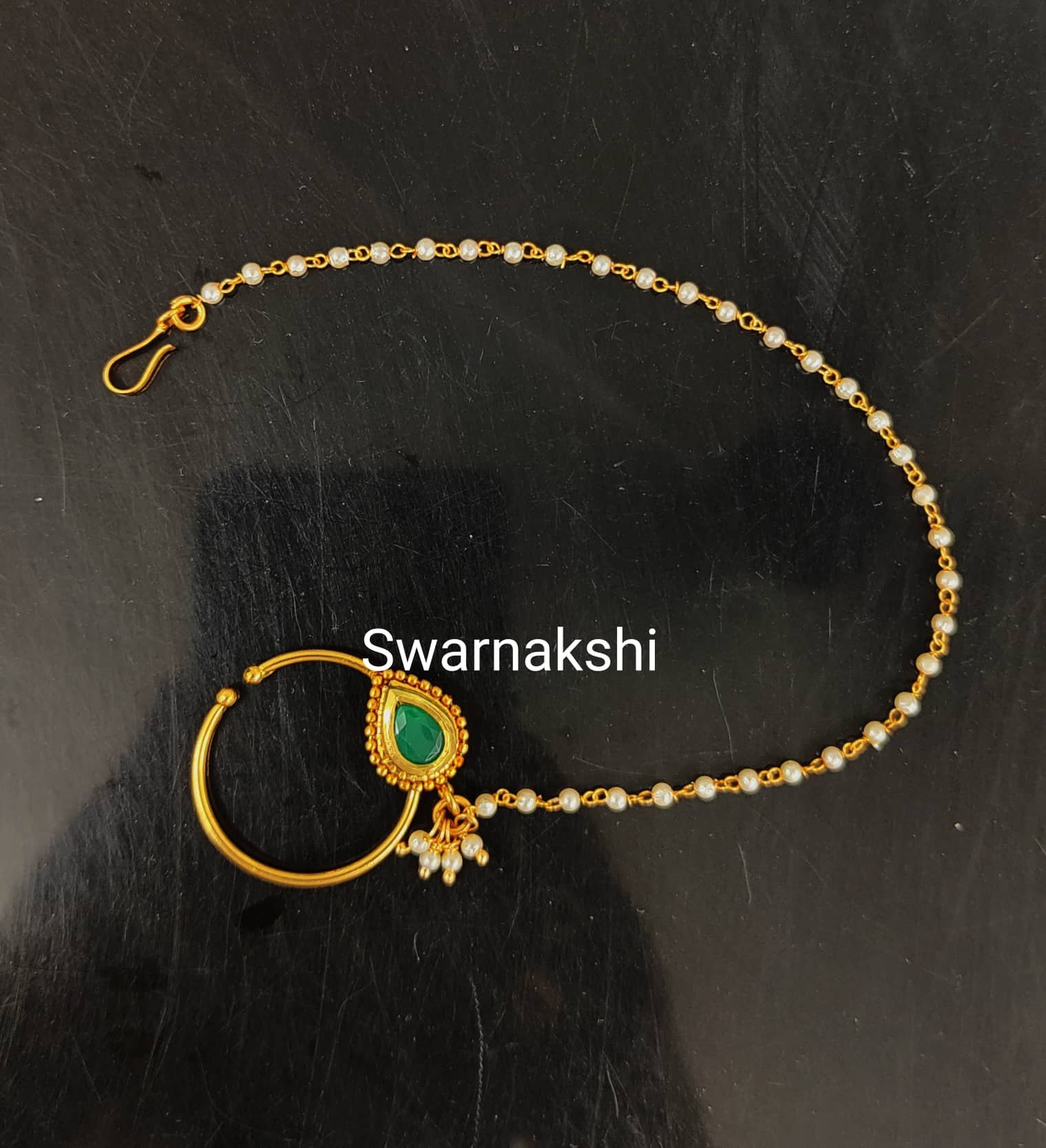 nose pins design with emerald stone beautiful model - Swarnakshi Jewels